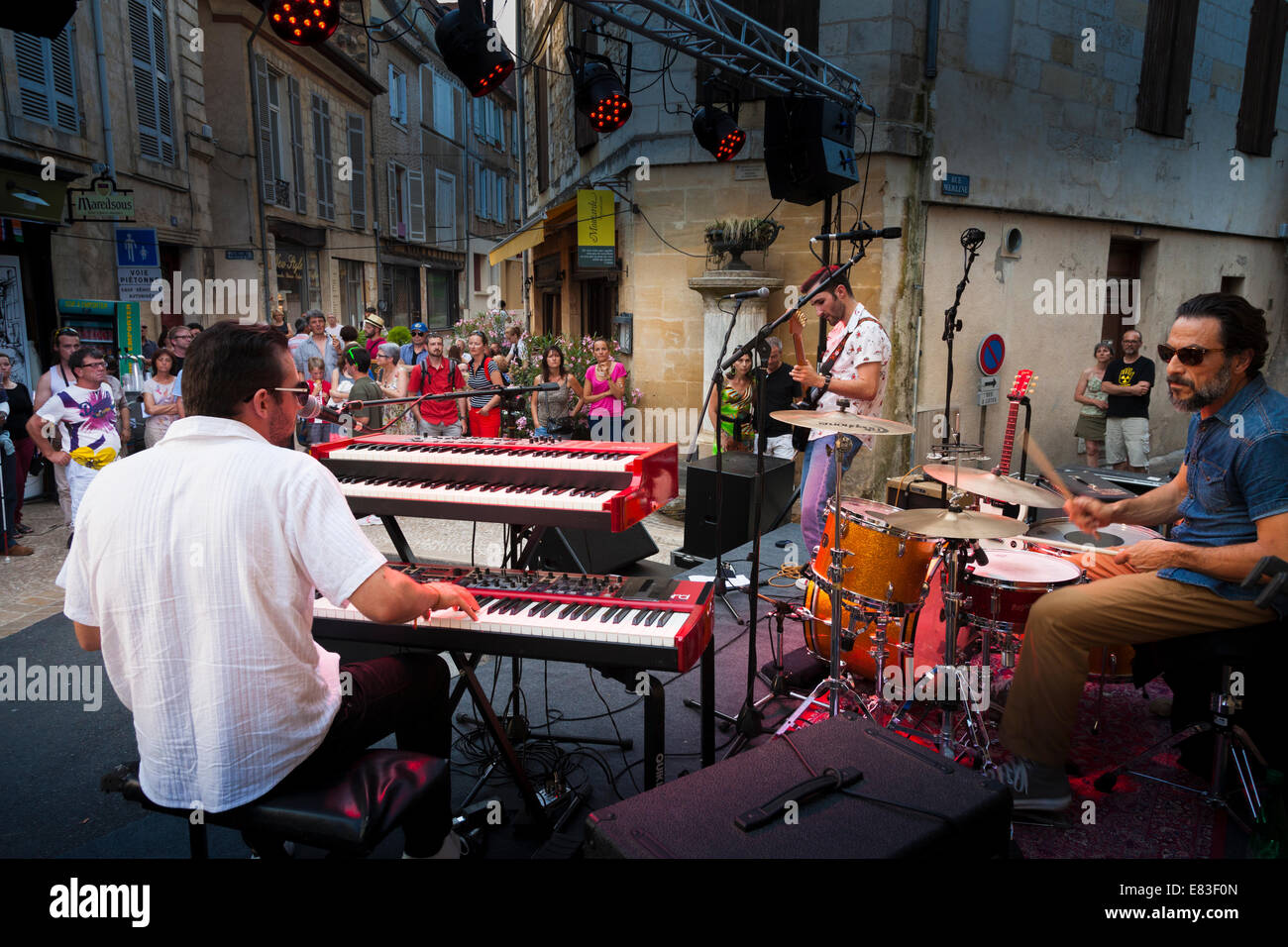 Band playing to audience in the streets of Bergerac during June music ...