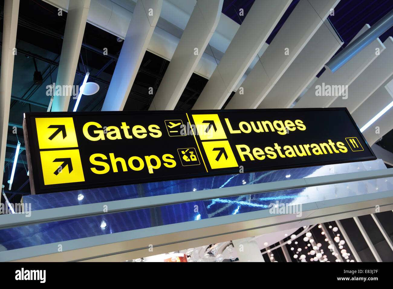 Airport terminal direction sign Stock Photo - Alamy
