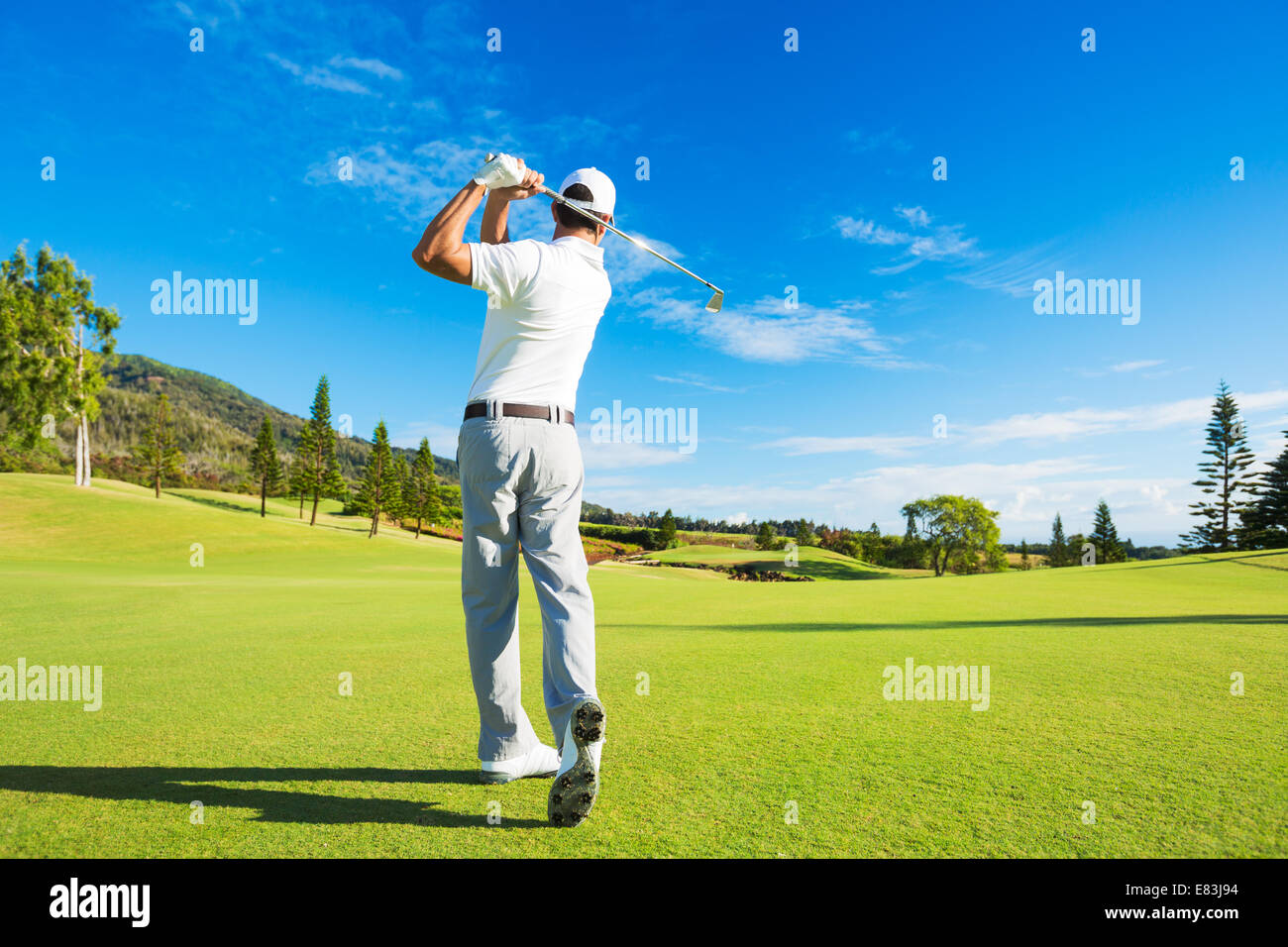 Golfer Hitting Golf Shot with Club on the Course Stock Photo - Alamy