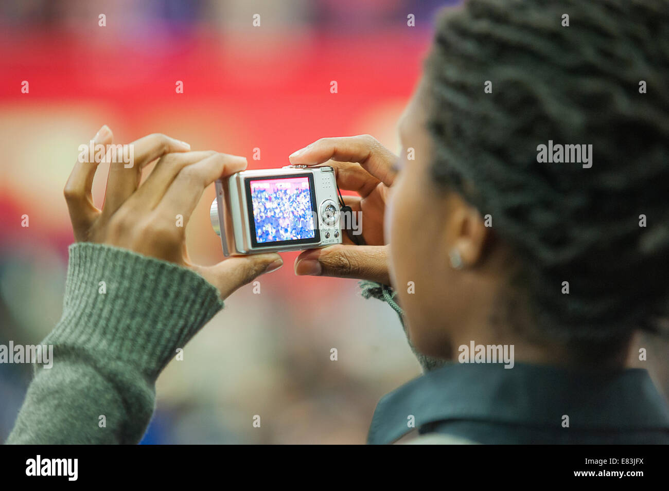 A tourist taking photographs with a pocket camera Stock Photo - Alamy