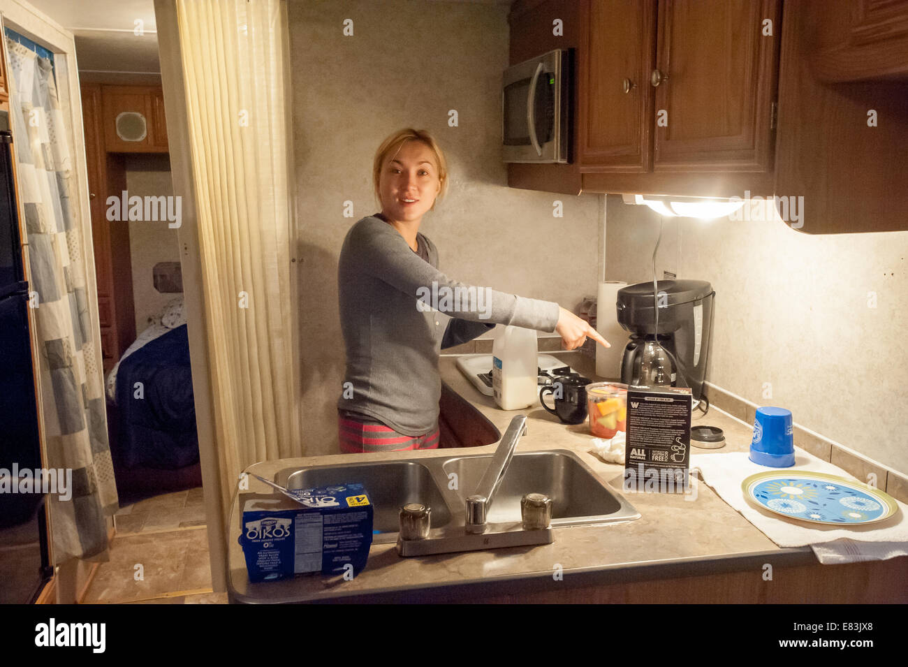 Woman cooking in RV kitchen Stock Photo - Alamy