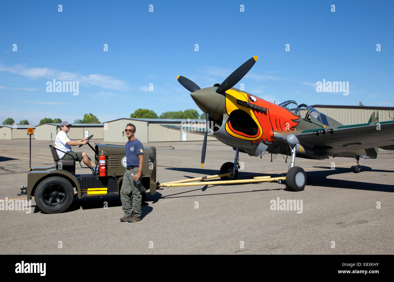 Restored Curtiss P-40 Warhawk being towed for take-off at Warbirds ...