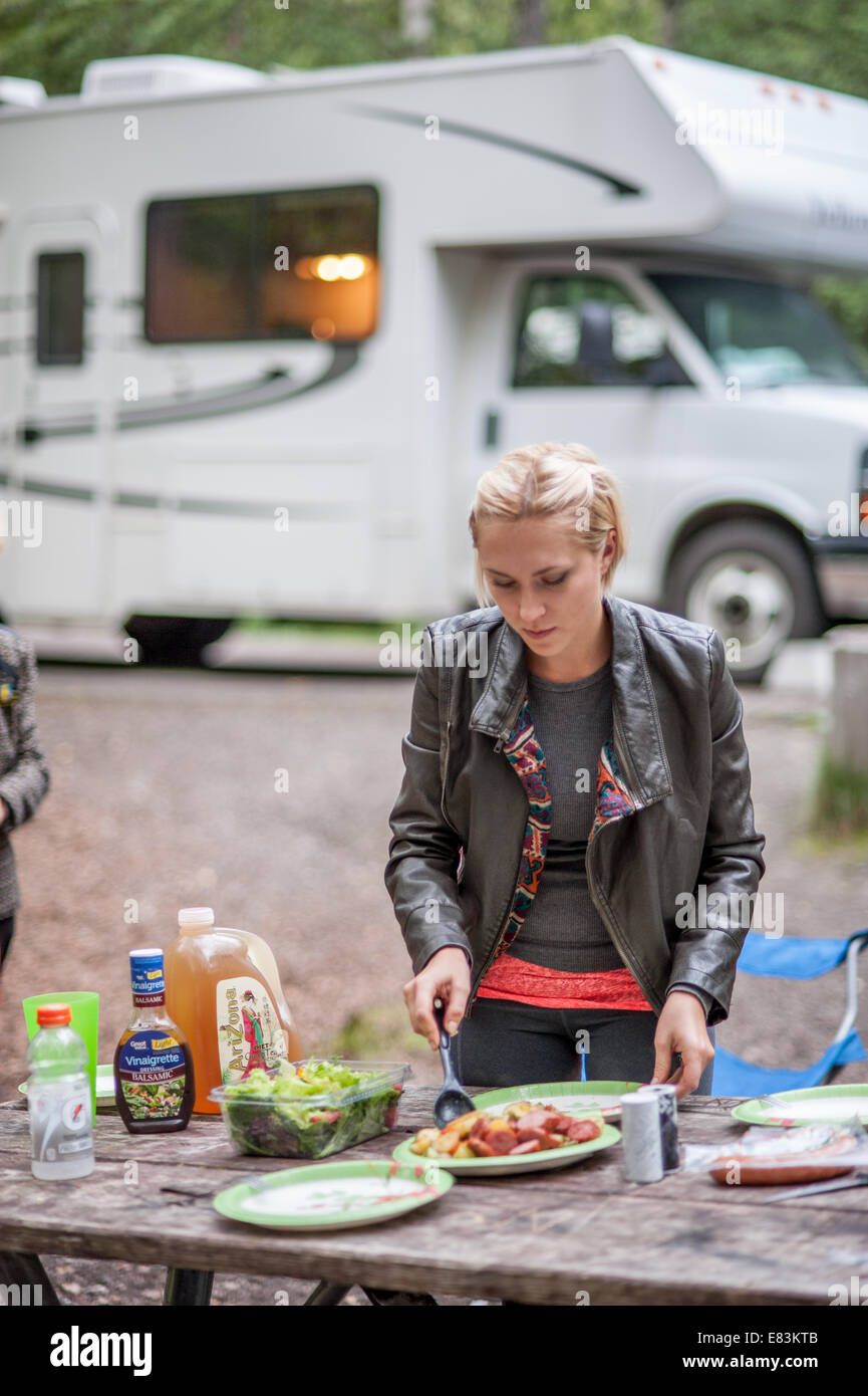 Woman preparing food at RV campsite Stock Photo - Alamy