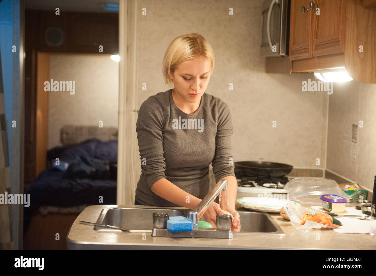 Woman cooking in RV kitchen Stock Photo - Alamy