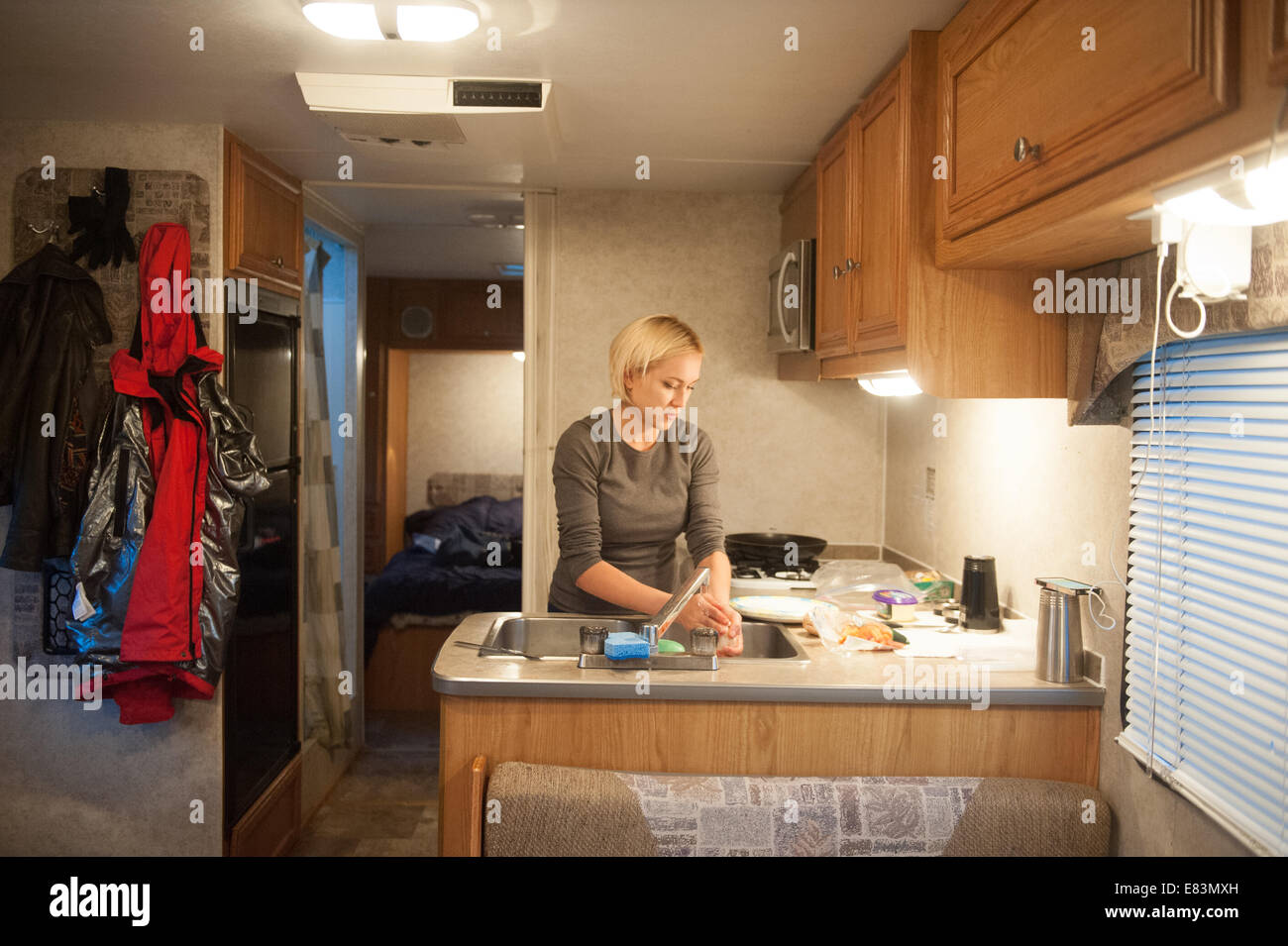 Woman cooking in RV kitchen Stock Photo - Alamy