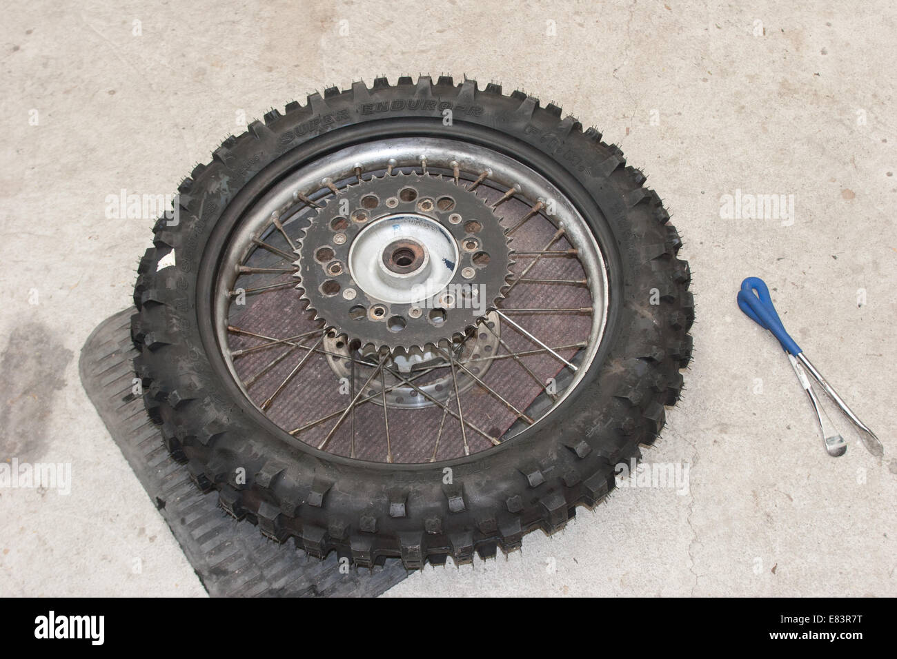 Motorcycle Maintenance - rear wheel tube and tyre Stock Photo - Alamy