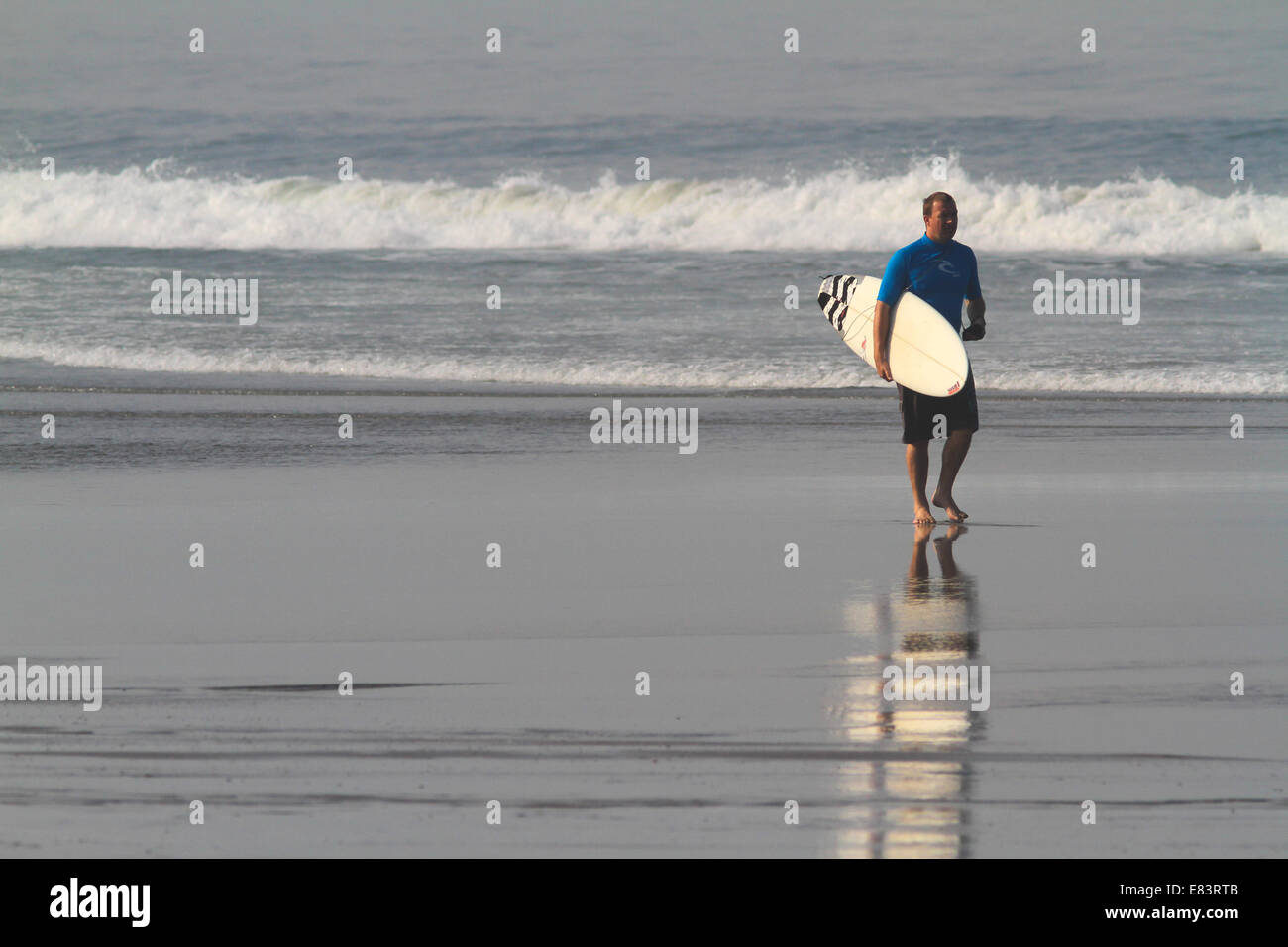Surfer on the beach. Bali island.Indonesia Stock Photo - Alamy