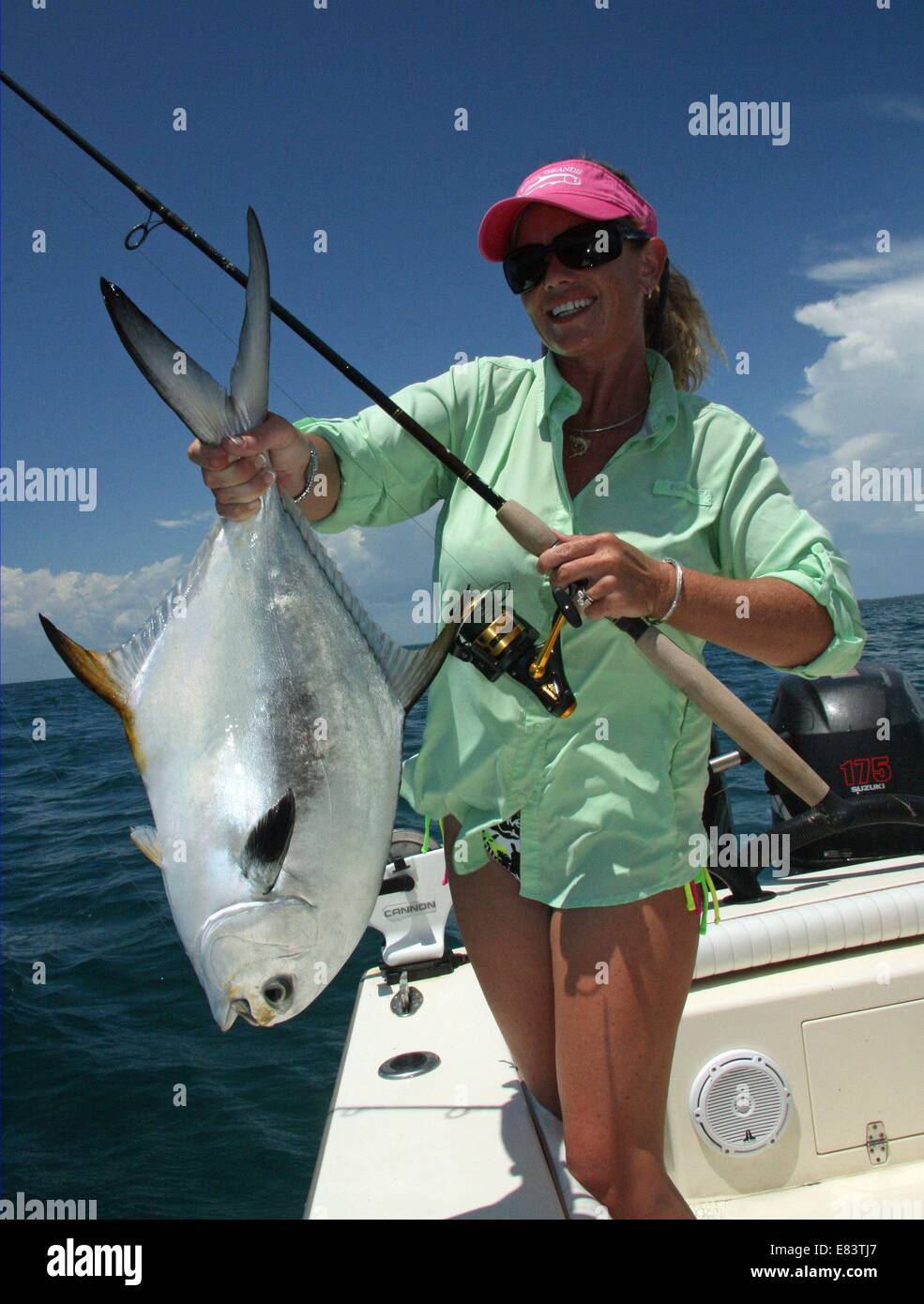 Woman fishing off beach hi-res stock photography and images - Alamy