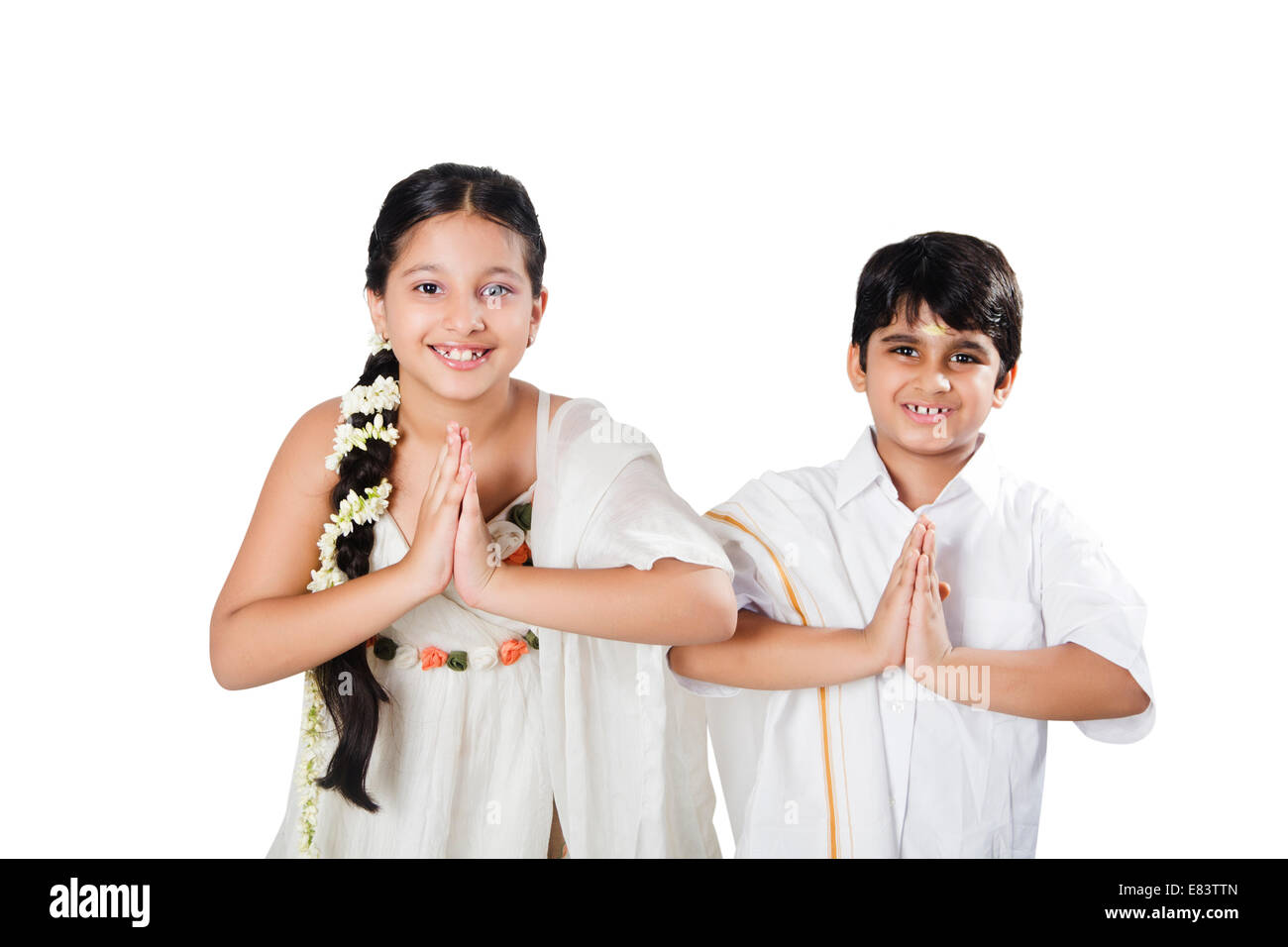 South indian children welcome standing hi-res stock photography and ...