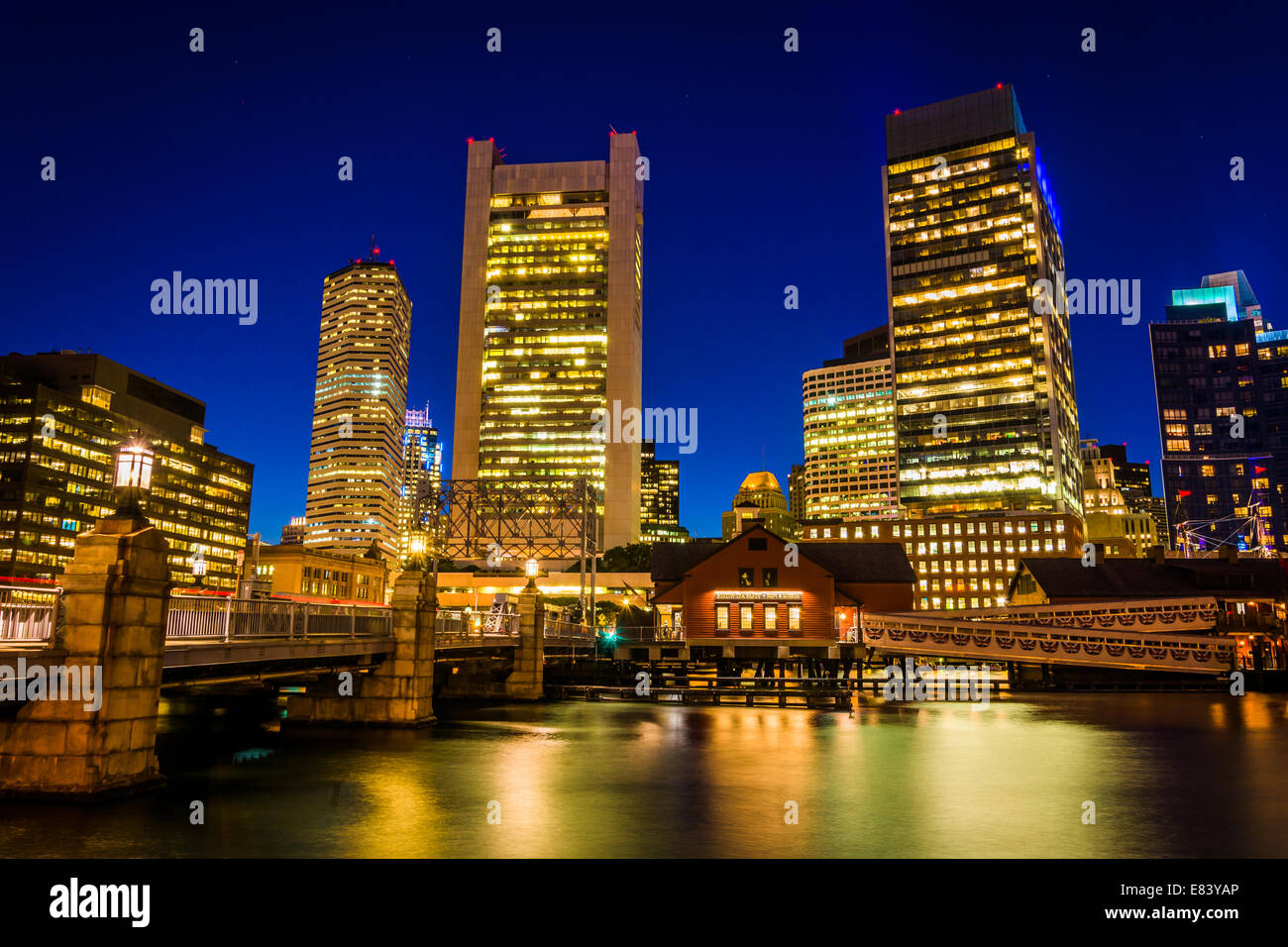 The Boston skyline at night, seen from Fort Point, Boston ...