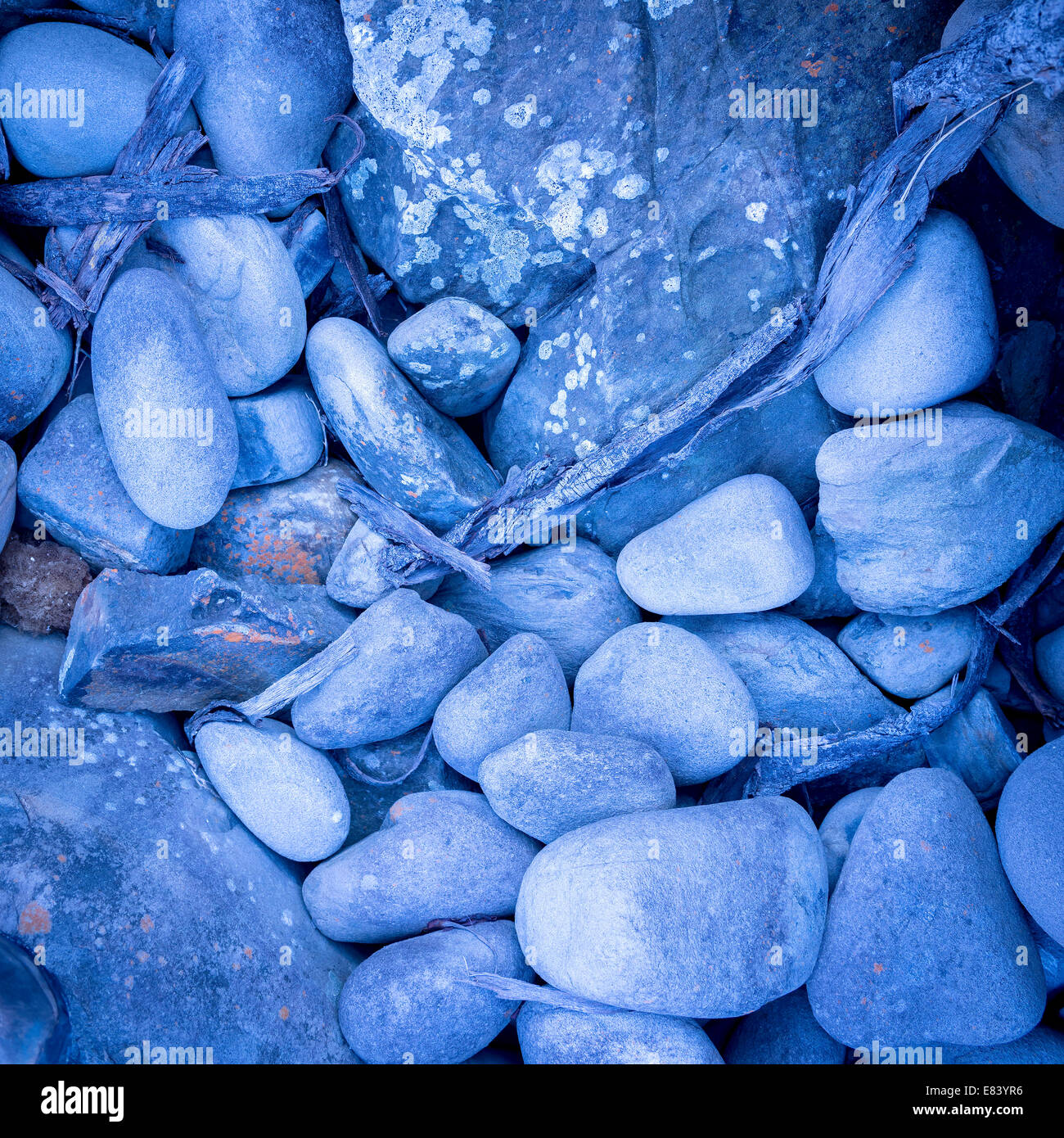 Blue toned zen rocks smoothed by the ocean Stock Photo - Alamy