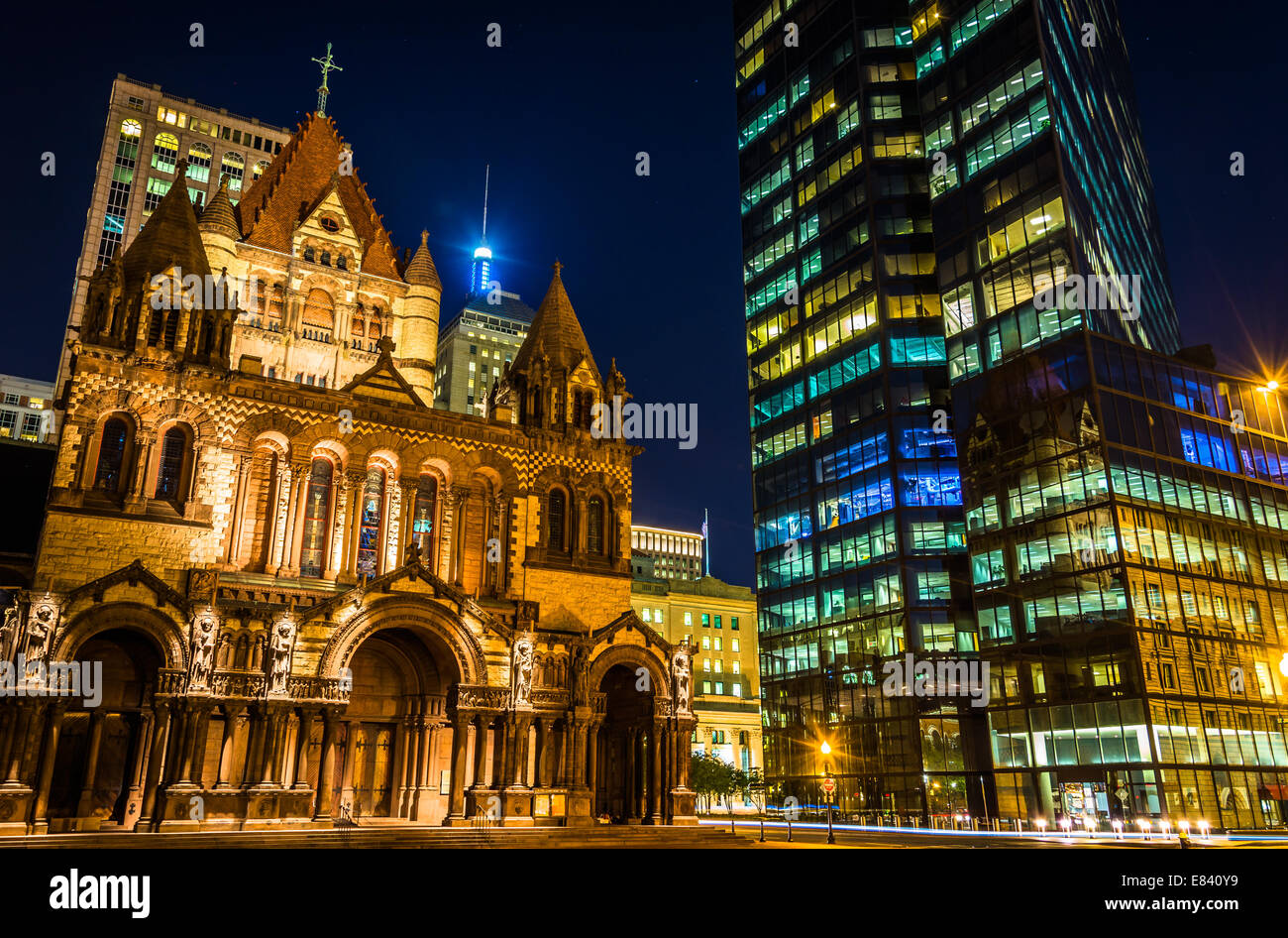 Trinity Church and the John Hancock Building at night, at Copley Square ...