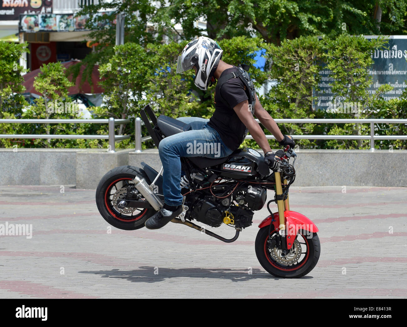 Motorcycle stunt rider performing, Cha Am, Thailand Stock Photo - Alamy