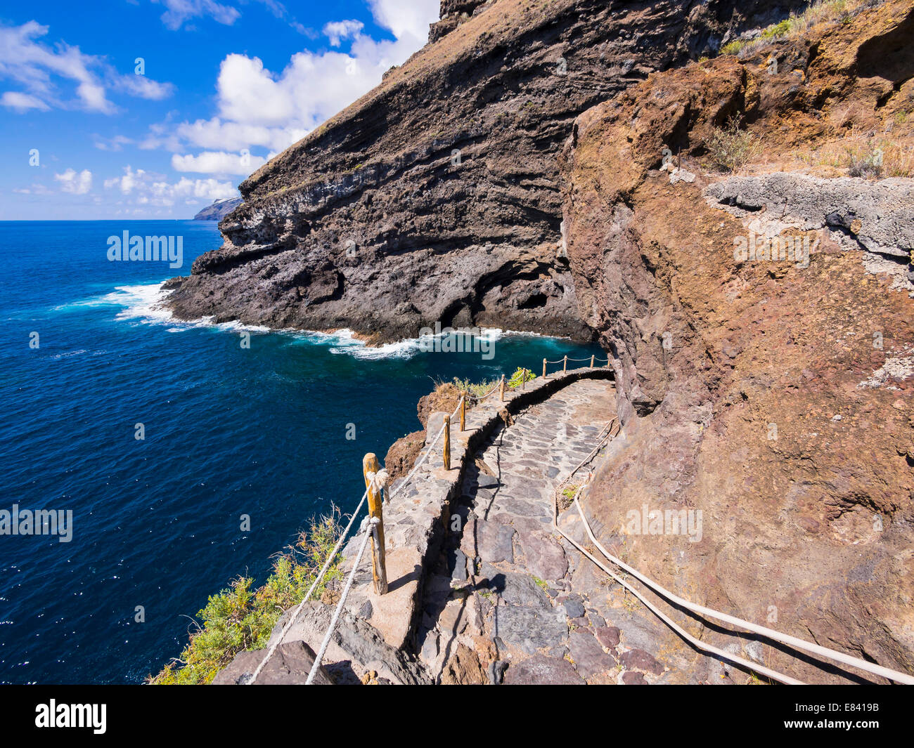 Rocky coastline on the Camino del Poris, route to Pirate's Cove ...