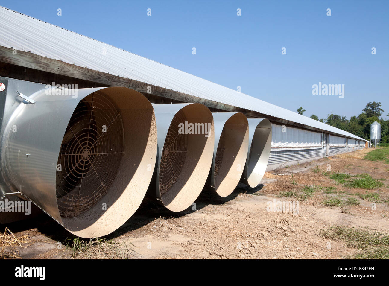 Four large air conditioning units on industrial farm poultry shed ...