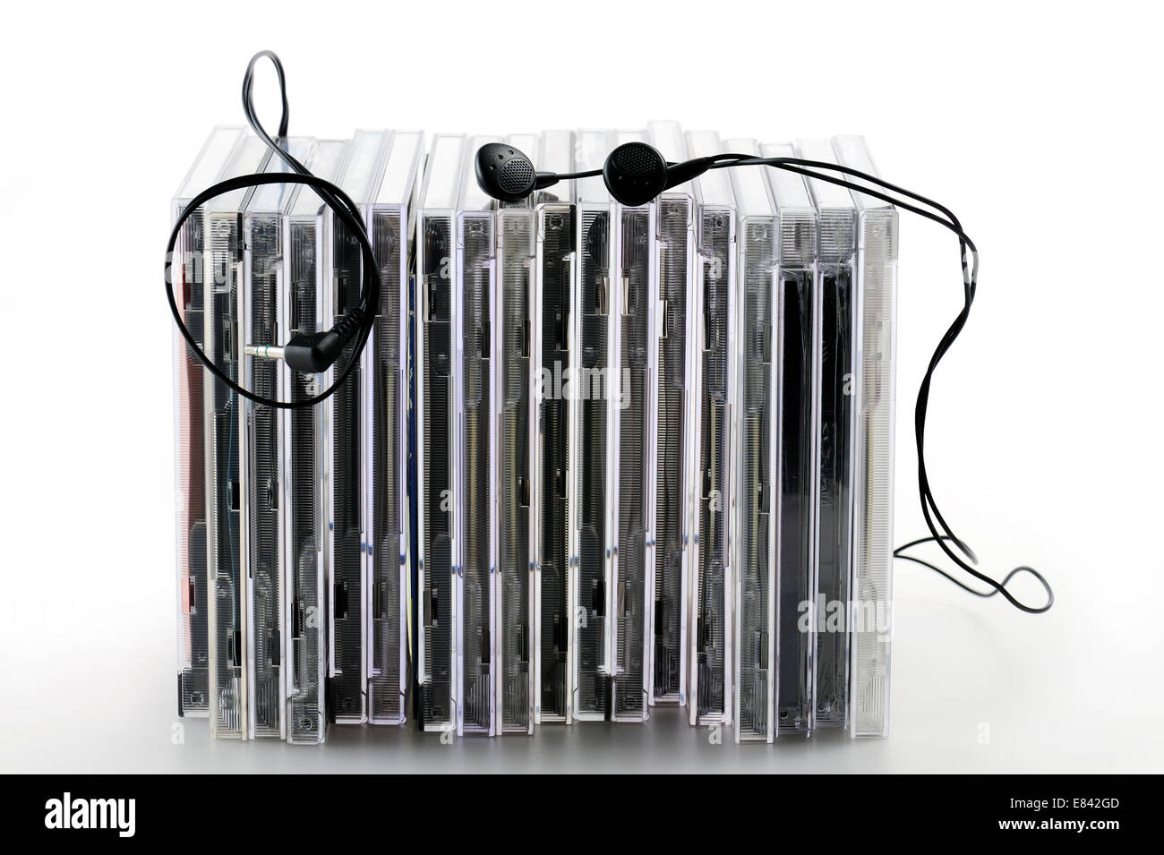 stack of compact disk with earphones, on white background Stock Photo ...