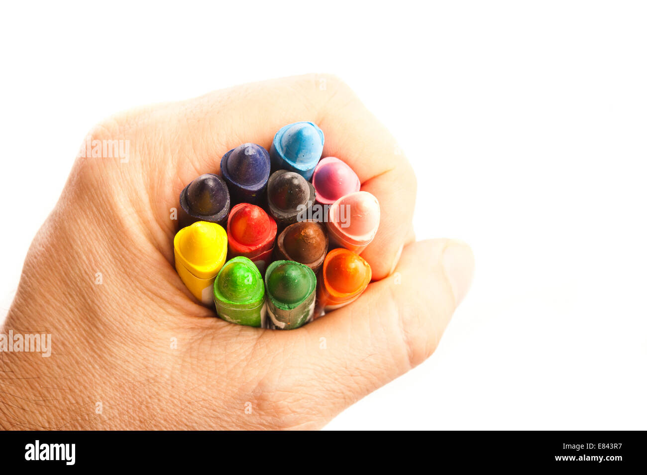 male hand holding colorful crayons Stock Photo - Alamy