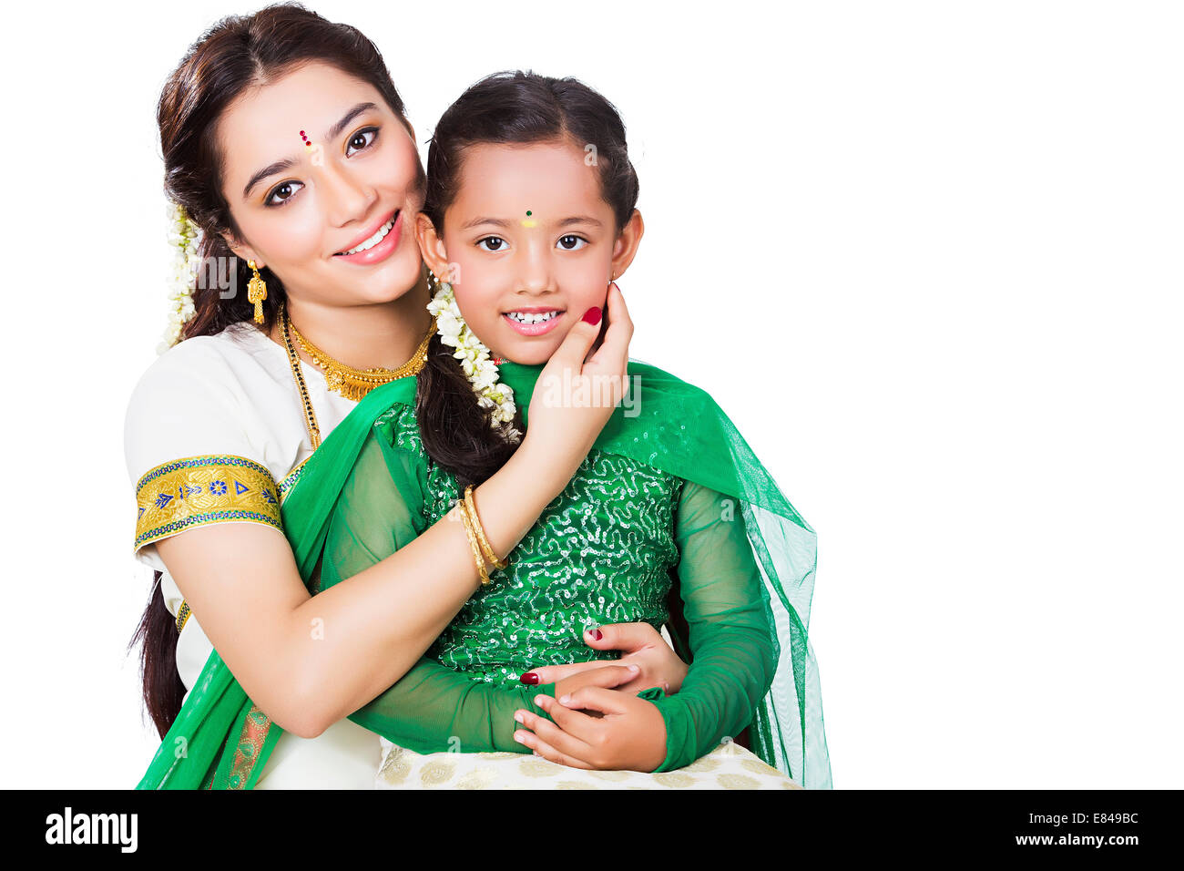 South Indian mother child care sitting Stock Photo - Alamy