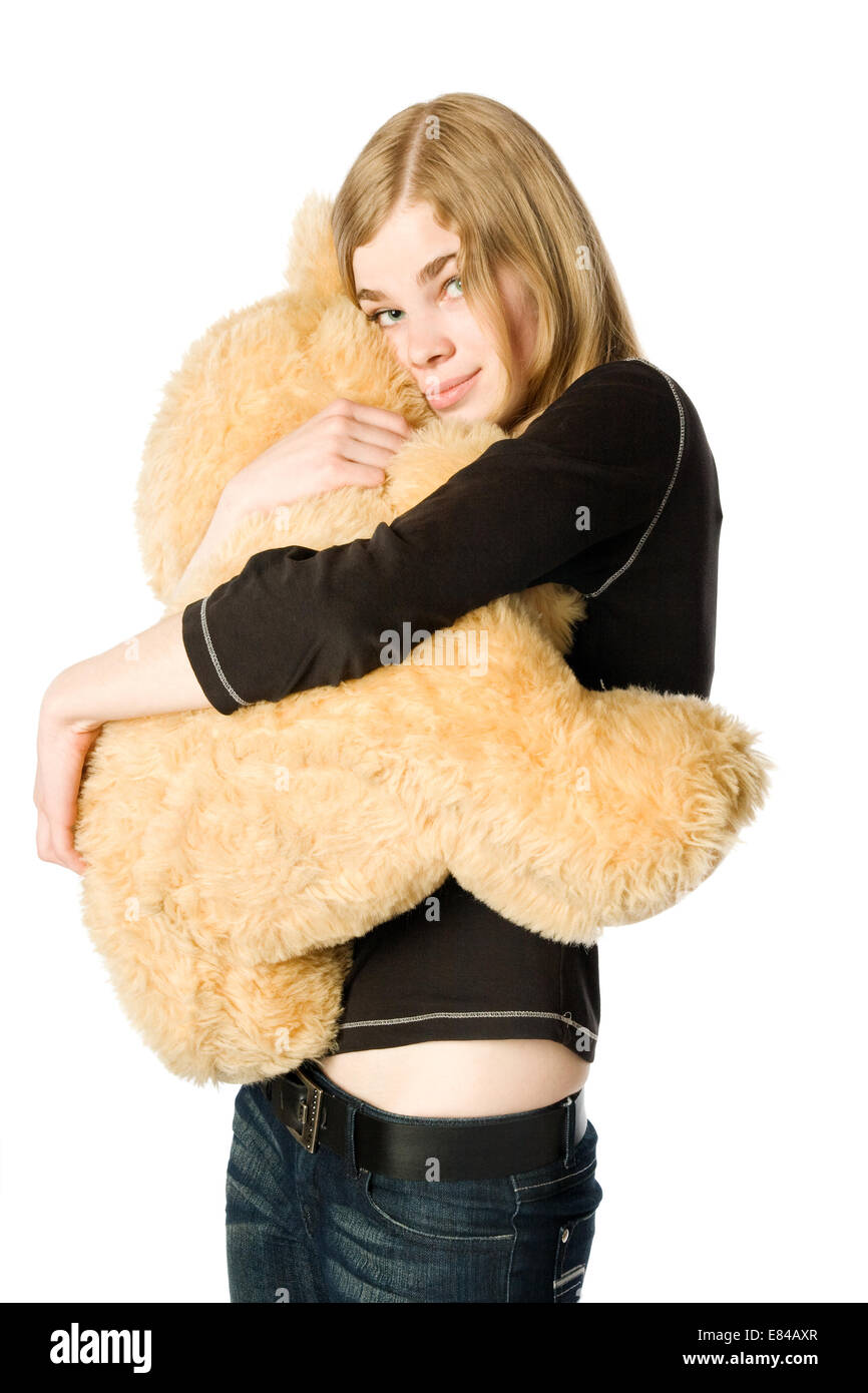 Young girl hugging a Teddy bear, isolated Stock Photo - Alamy