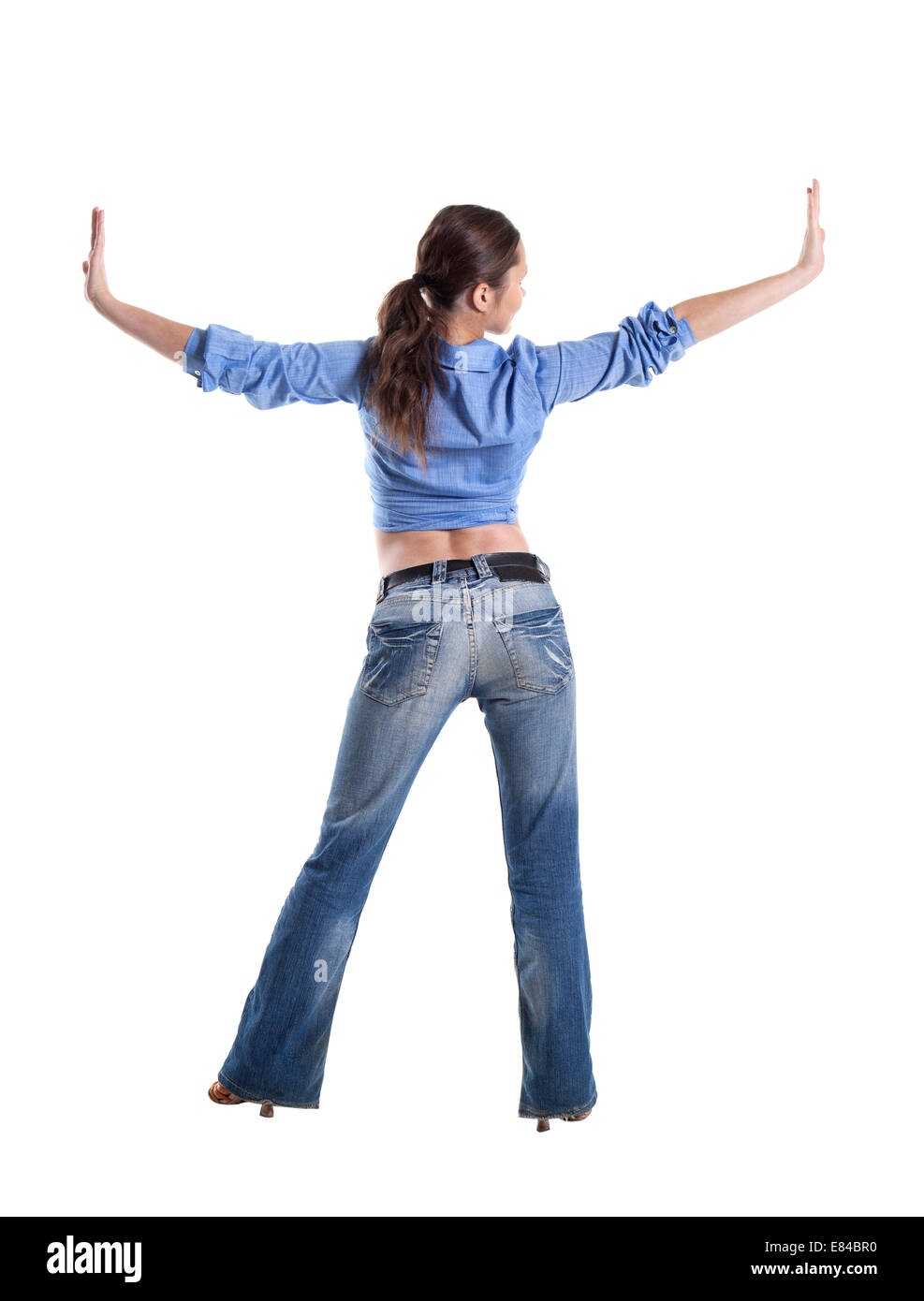 Back view of a young woman, arms extended sideways Stock Photo - Alamy
