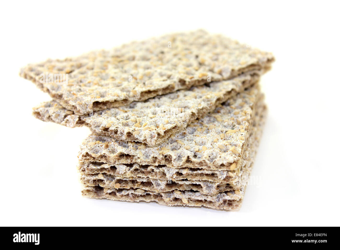 a stack of crispbread in front of white background Stock Photo - Alamy