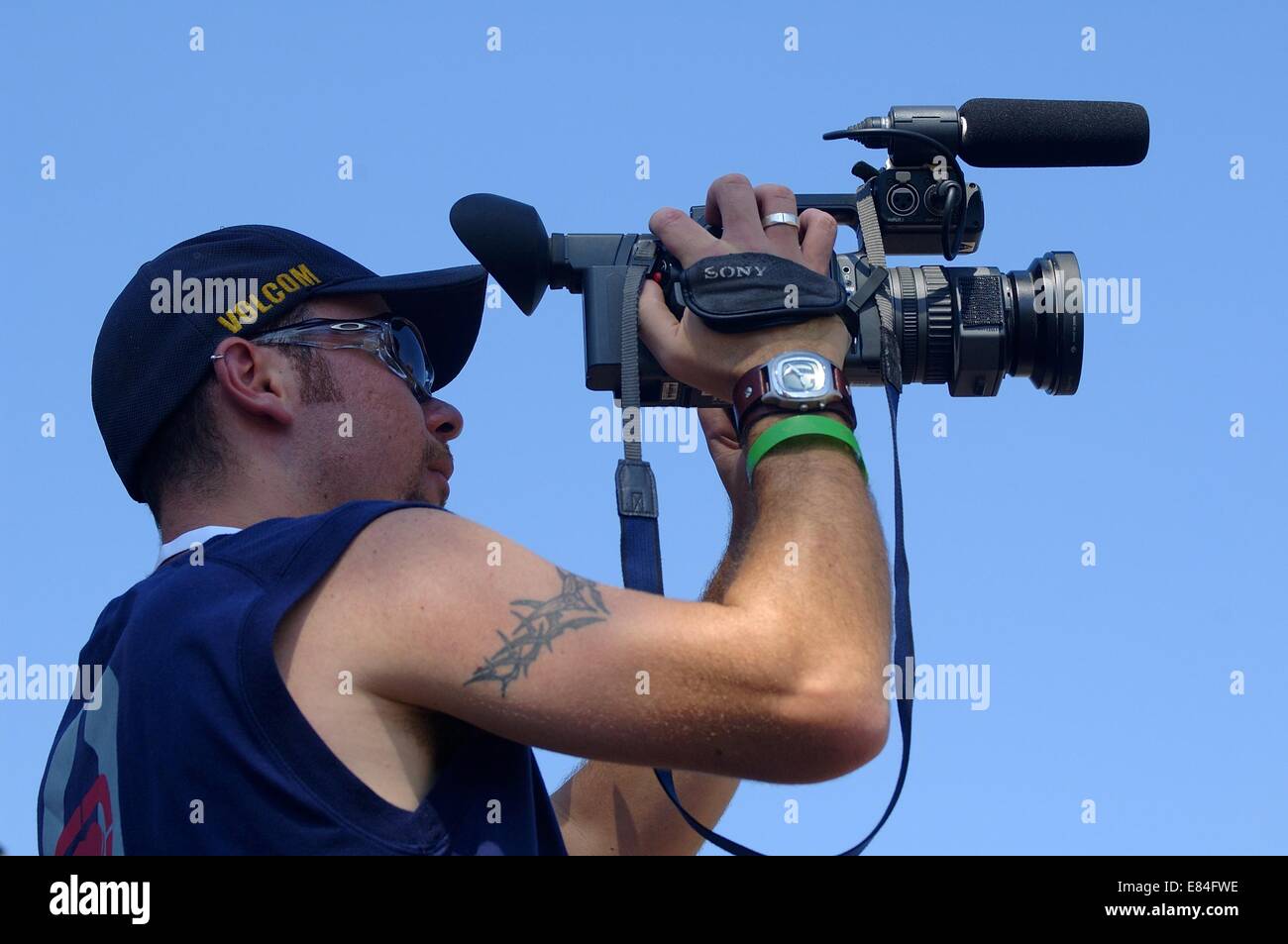 A videographer filming with Sony video camera Stock Photo - Alamy