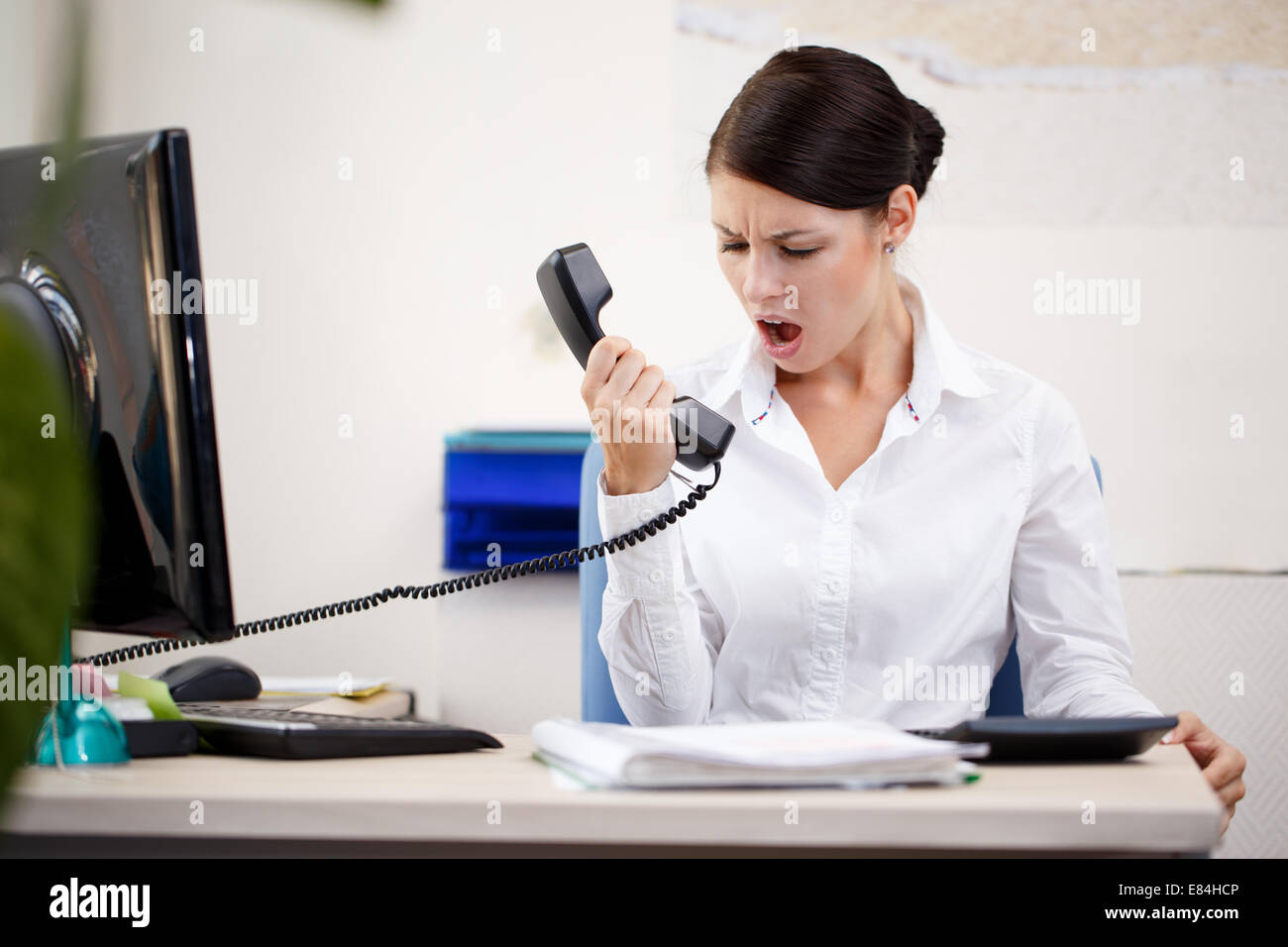 Angry woman shouting at phone Stock Photo - Alamy