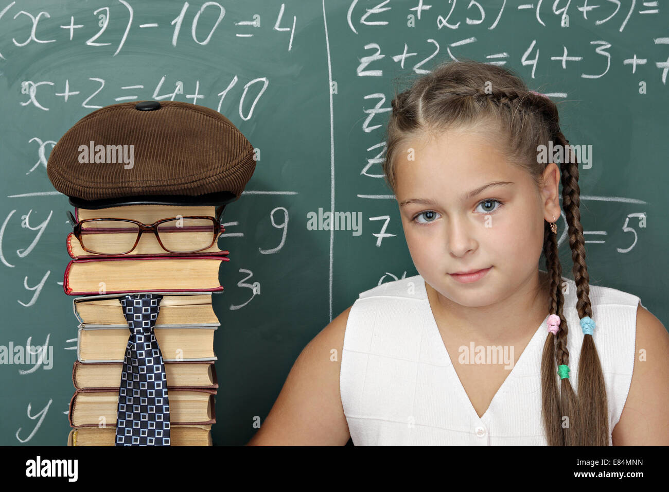 Unusual school concept, schoolgirl with textbooks as a helpers to ...