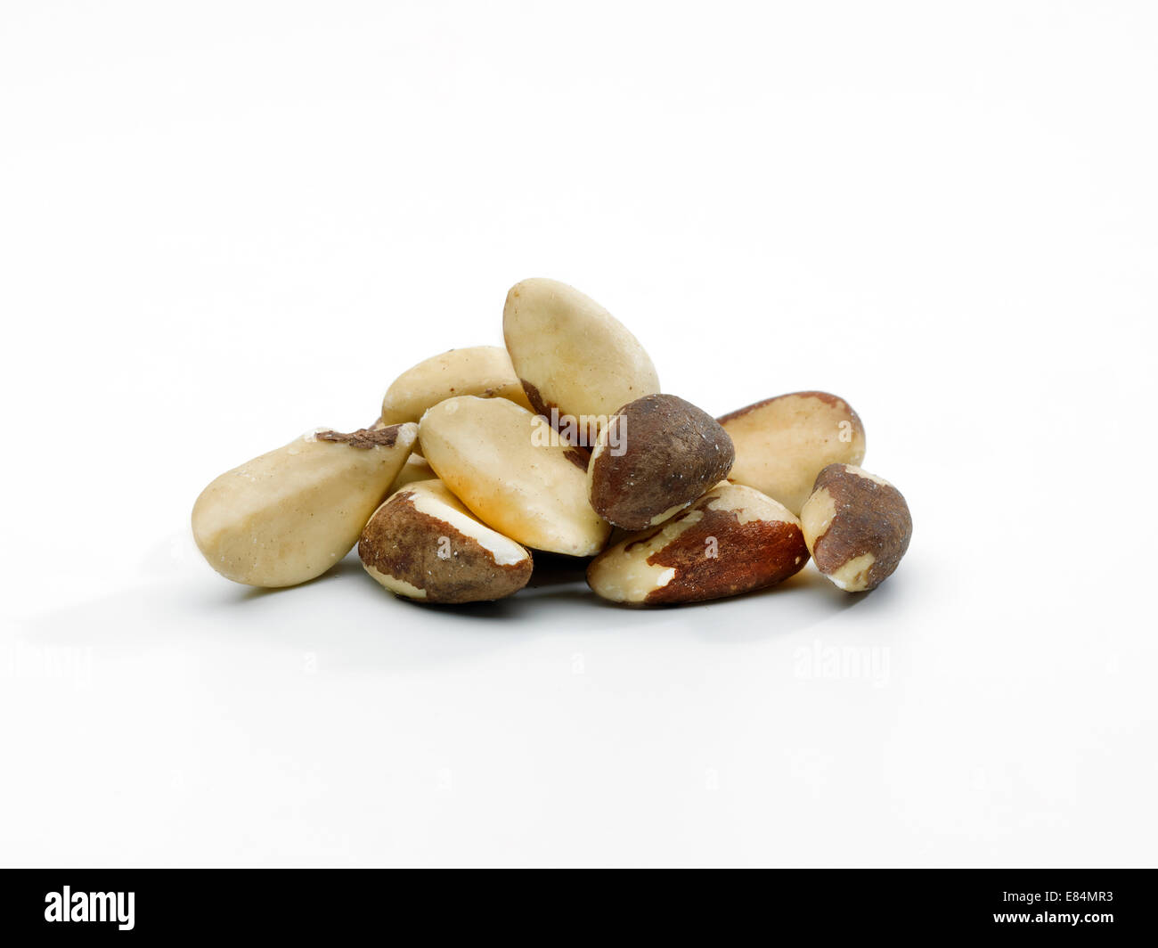 a pile of shelled Brazil nuts on a white background Stock Photo - Alamy