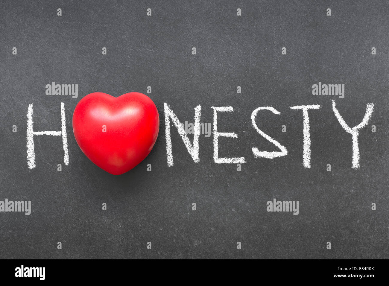 honesty word handwritten on chalkboard with heart symbol instead of O ...