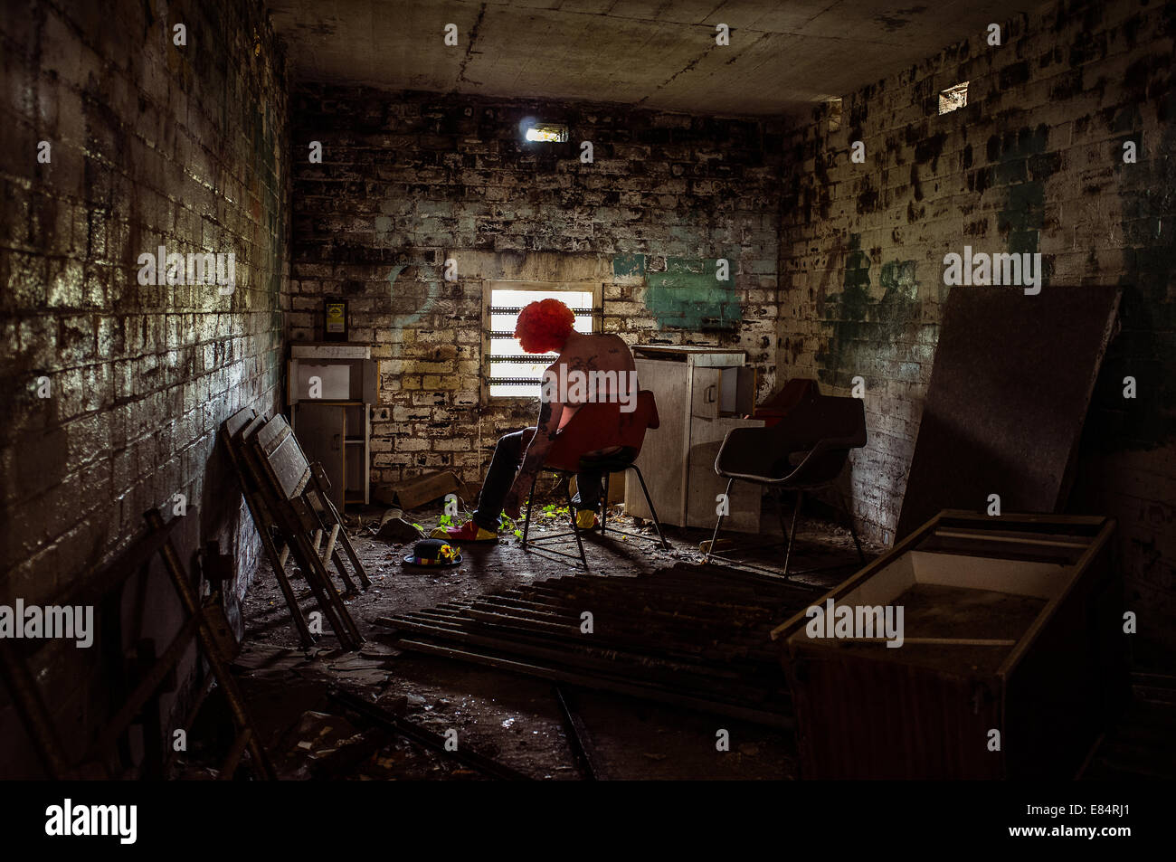 Death of a Clown, a topless circus clown slumped in chair, back to ...