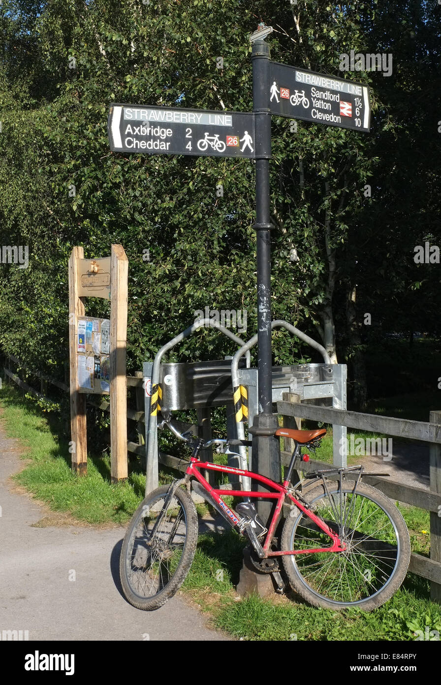 Red steel bike resting on the direction sign post on the Cheddar to ...