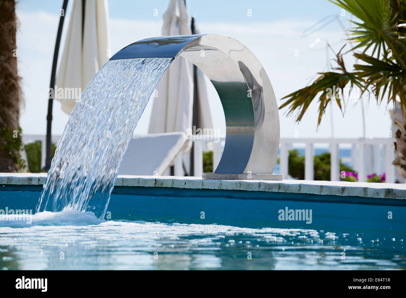 waterfall jet swimming pool Stock Photo - Alamy