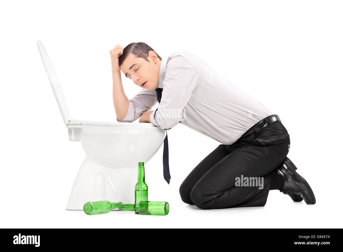 Drunk guy leaning over a toilet isolated on white background Stock ...