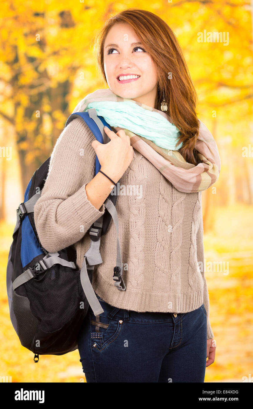 Beuatiful young student going back to school on fall Stock Photo - Alamy