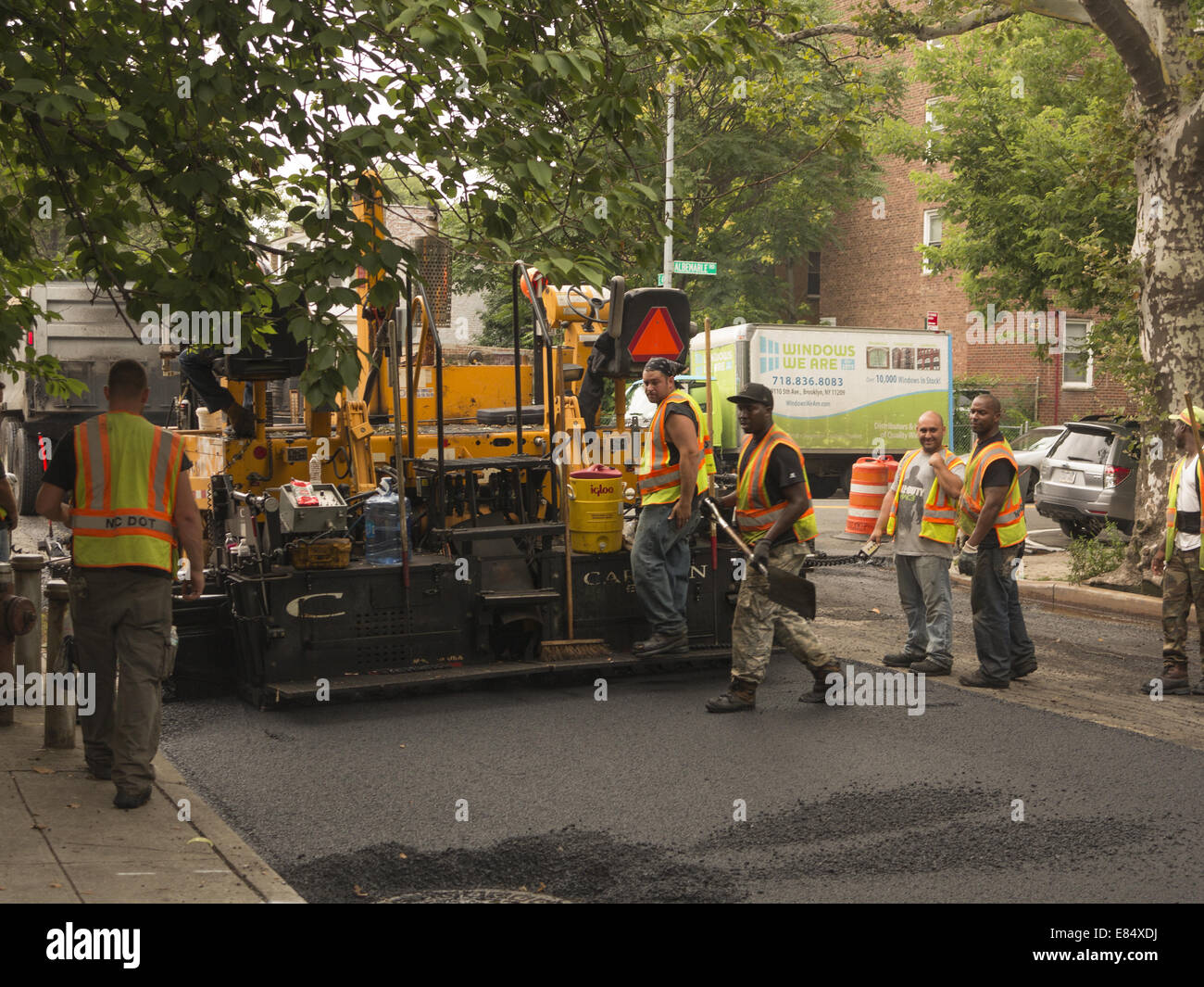 Road crew resurfaces a street in Brooklyn, NY Stock Photo - Alamy
