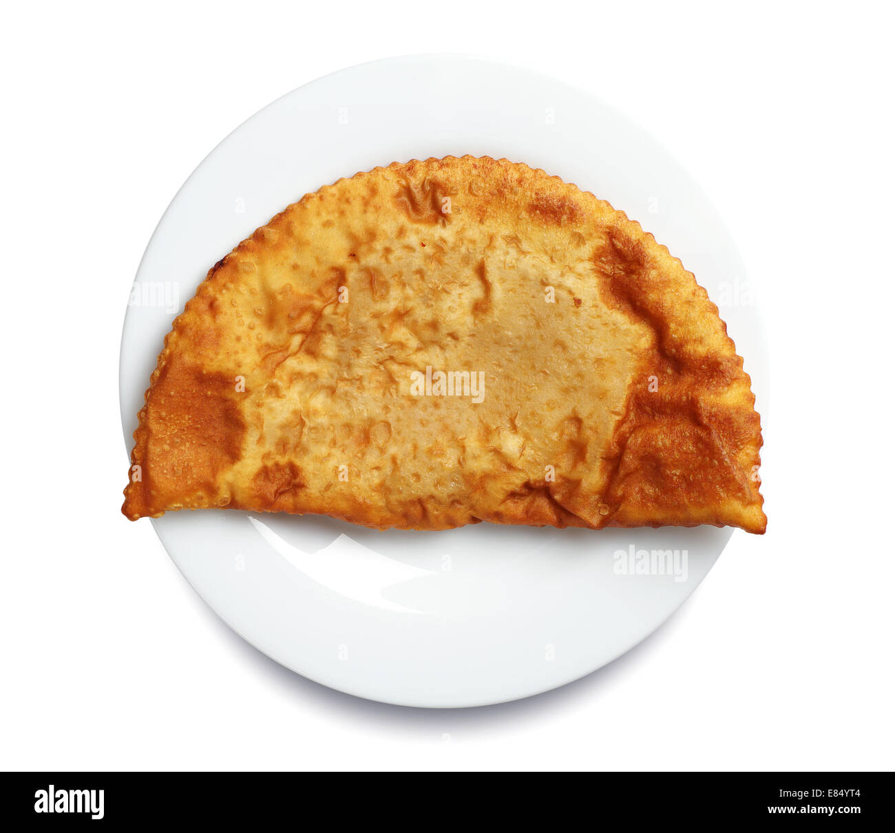 Large pasties in a plate on white background Stock Photo - Alamy