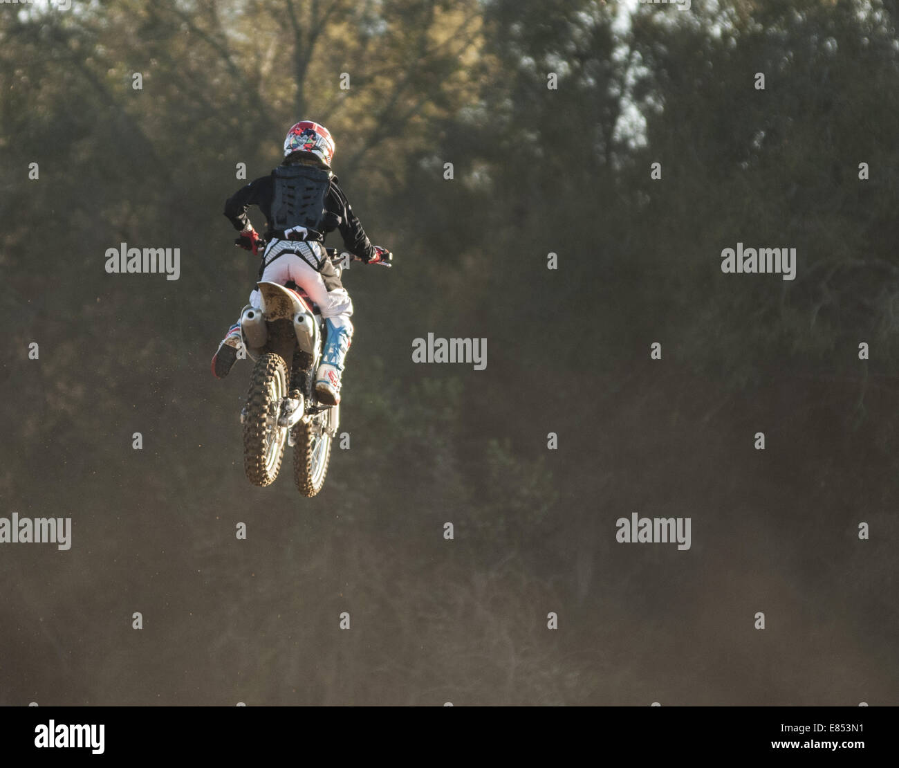 Single motor cross rider jumping high Stock Photo - Alamy