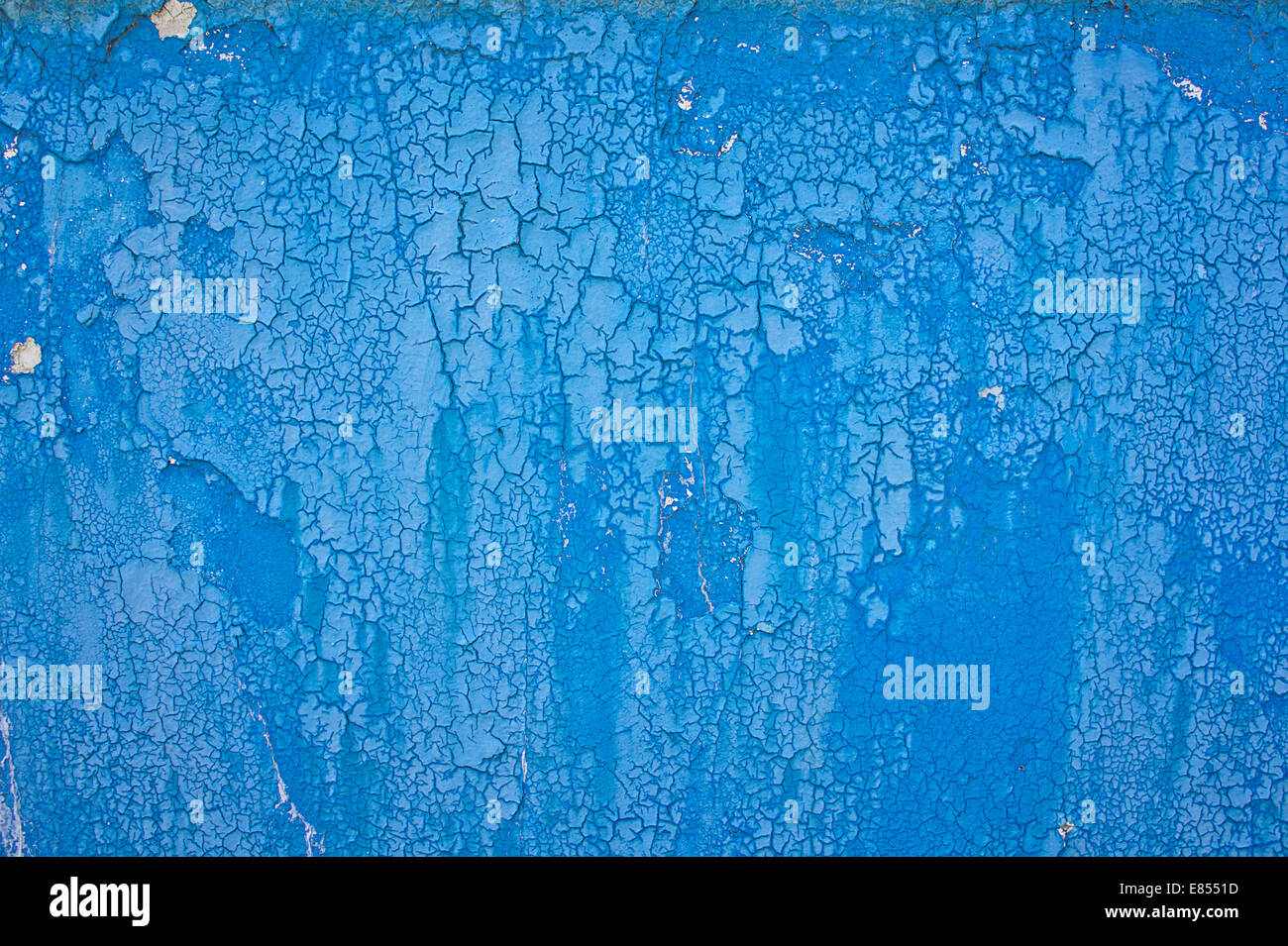 Blue, old, cracked peeling paint pattern. Blue old damaged wall. For ...