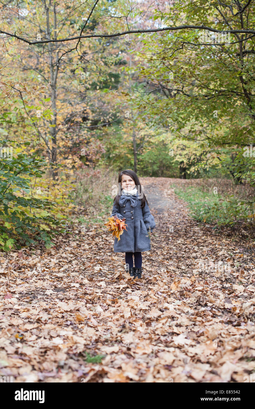 little girl in autumn park Stock Photo - Alamy