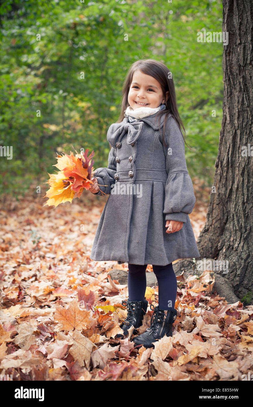 little girl in autumn park Stock Photo - Alamy