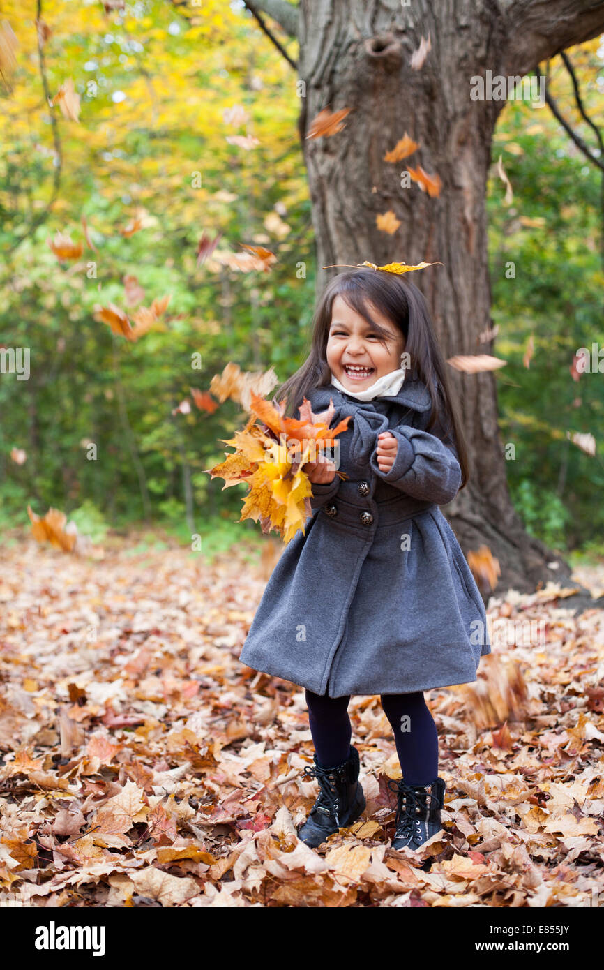 little girl in autumn park Stock Photo - Alamy
