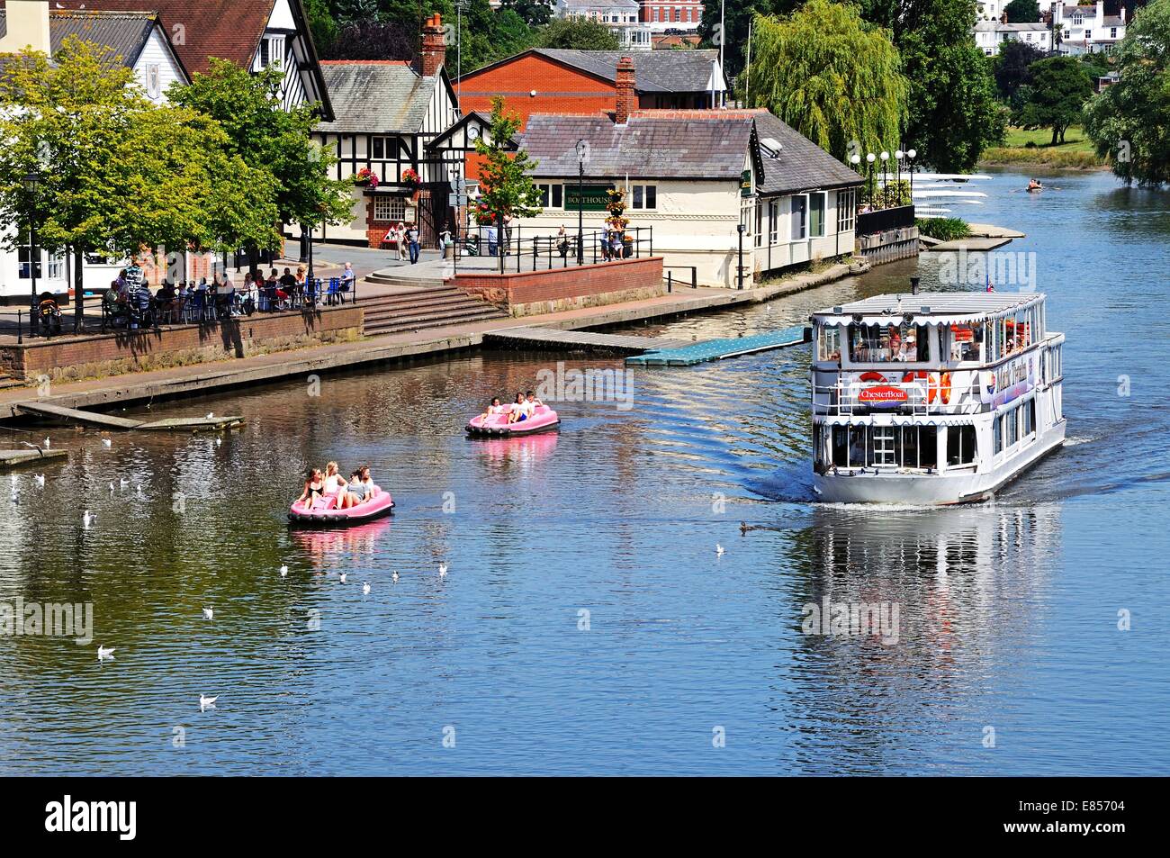 River ferry and pedalos on the River Dee, Chester, Cheshire, England ...