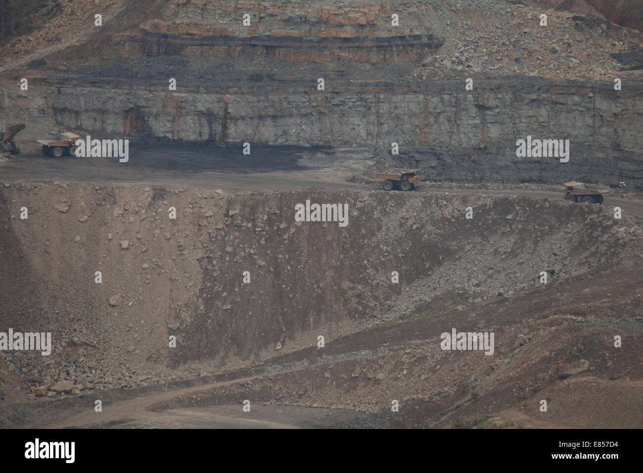 Coal mining dump trucks excavating mountaintop, Appalachia, Wise County ...