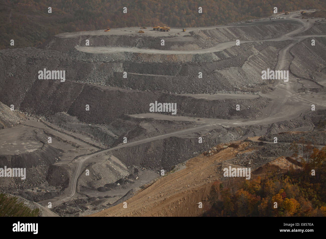 Coal mining slag heaps and dirt tracks on excavated mountaintop ...