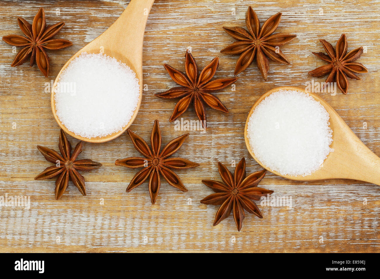 White sugar on wooden spoons and star anise Stock Photo - Alamy