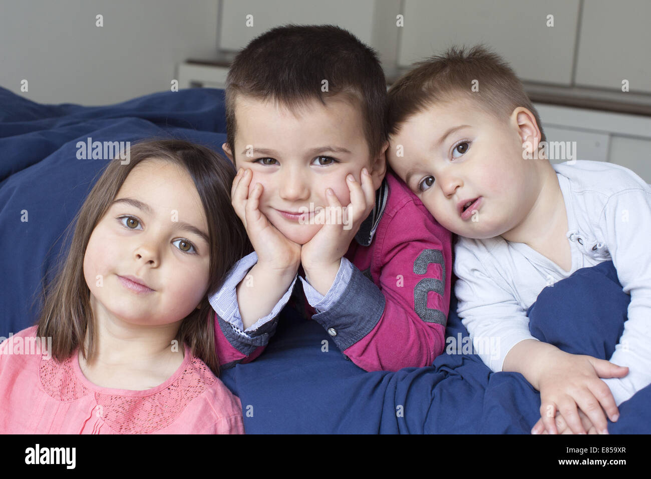 Portrait three sisters lying on hi-res stock photography and images - Alamy