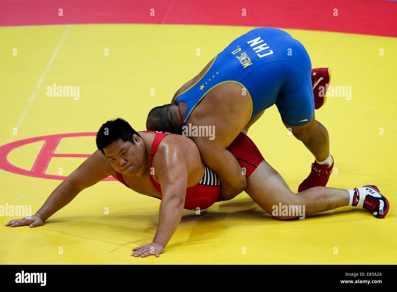 Incheon, South Korea. 1st Oct, 2014. Meng Qiang (upper) of China fights ...