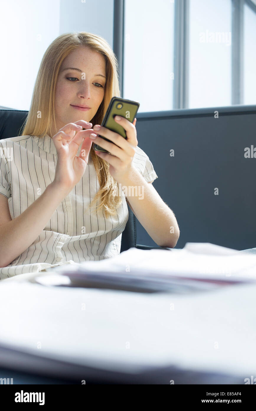 College student using smartphone during study break Stock Photo - Alamy