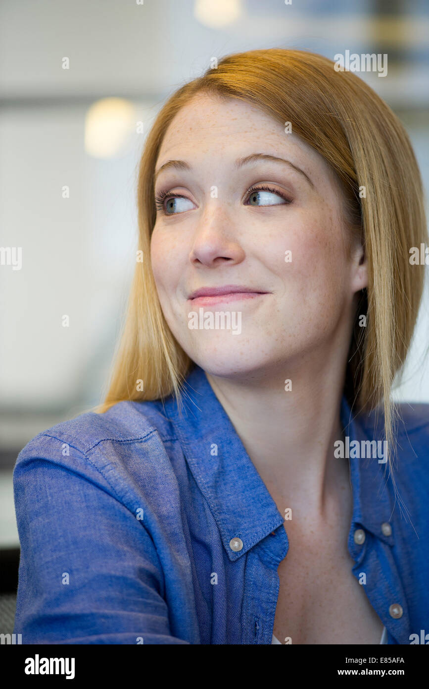 Young woman giving knowing look Stock Photo - Alamy Young woman giving knowing look Stock Photo - Alamy
